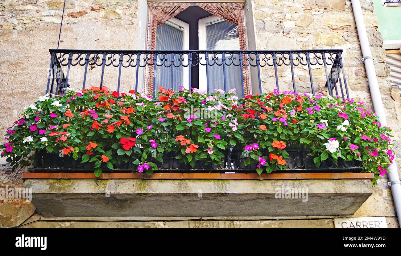 Balcony with flowers in Castellar de N'hug in Girona, Catalonia, Spain ...