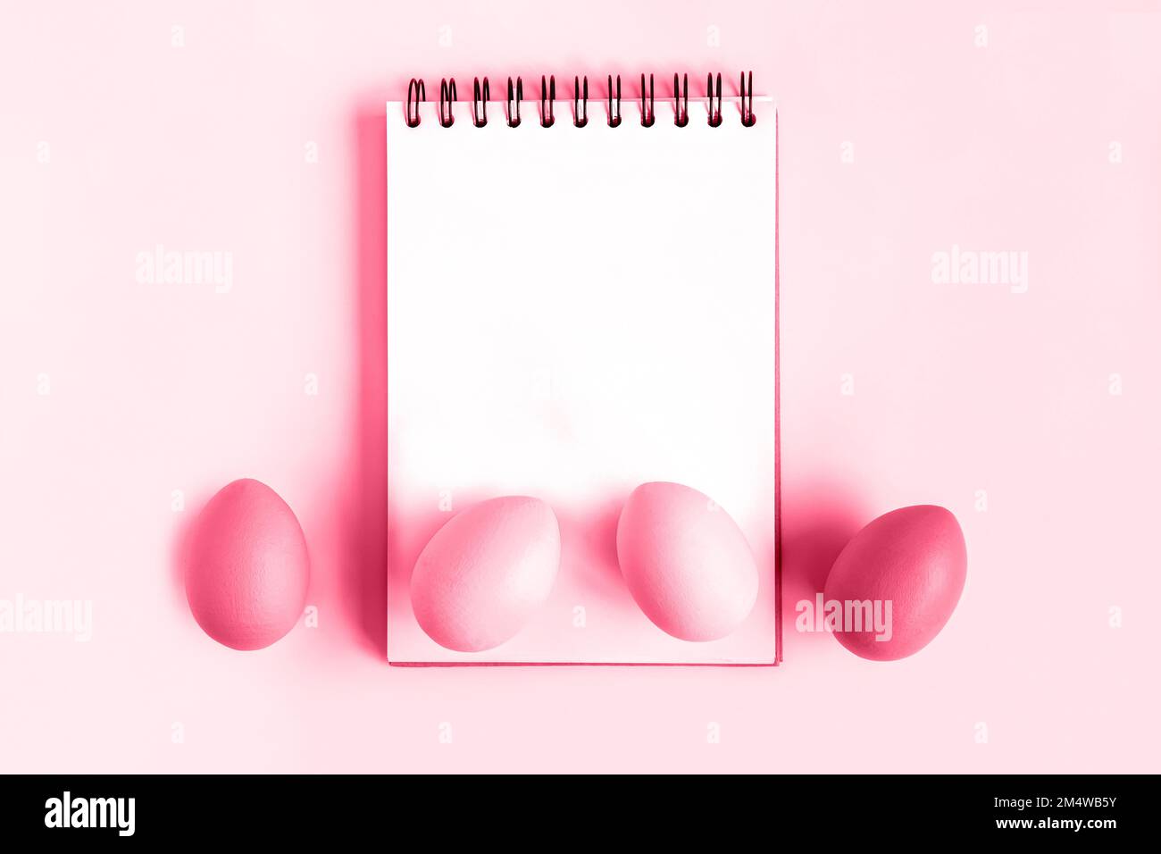 Notebook with Easter Eggs. Spiral notepad on spring white background ...