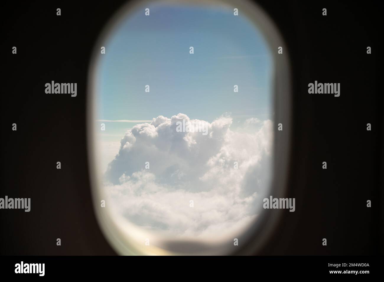 A cloudy sky view out of an airplane window Stock Photo - Alamy