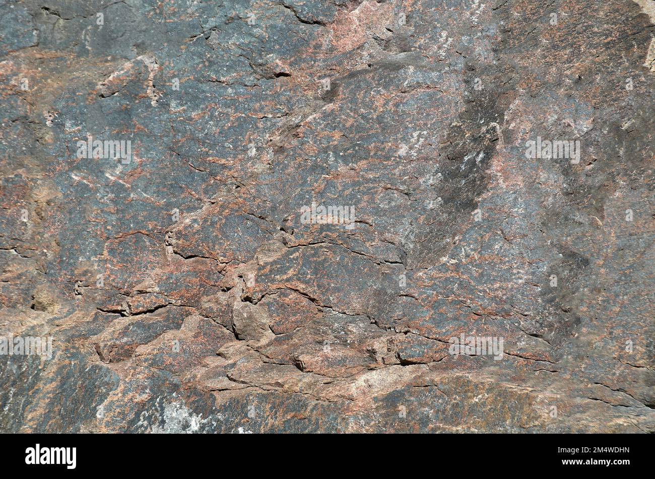 Close-up of black and red rough natural mountain texture Stock Photo ...