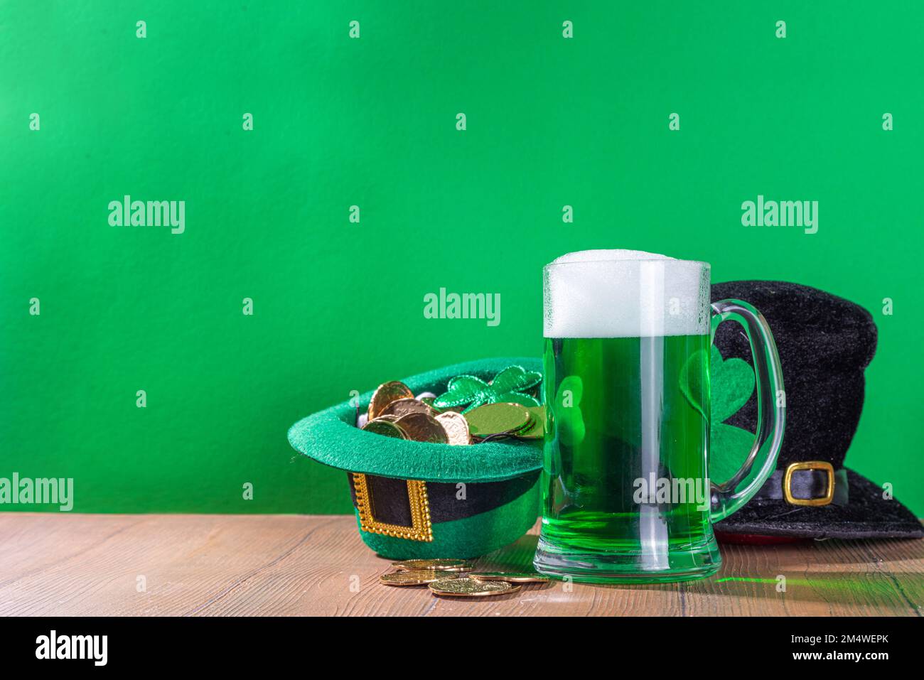 Beer glasses with leprechaun hat, shamrock clover leaves, traditional ...