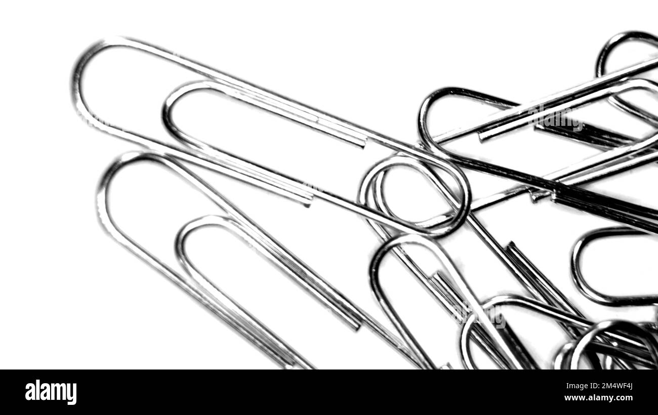 Clips on white paper Stock Photo - Alamy