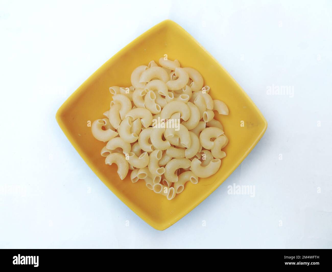 Macaroni are dry pasta, shaped like narrow tubes. Made with durum wheat ...