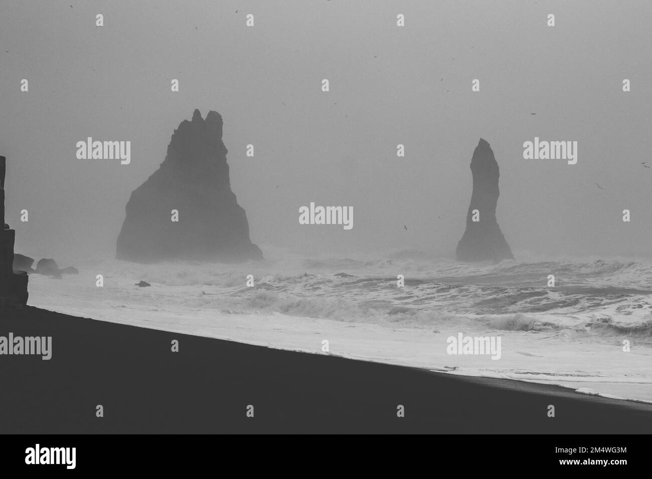 High rocks on beach monochrome landscape photo Stock Photo - Alamy