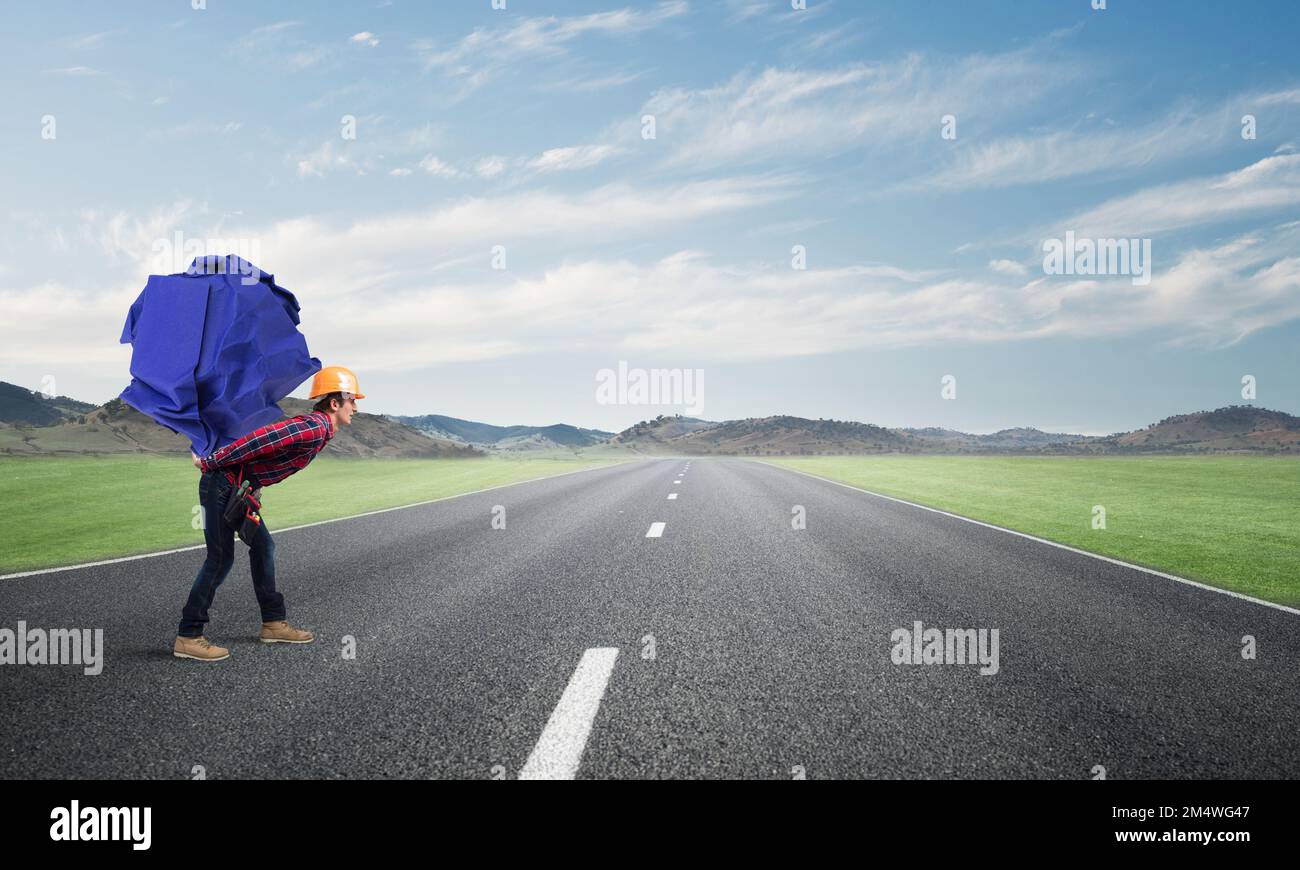 Engineer man carry load Stock Photo - Alamy