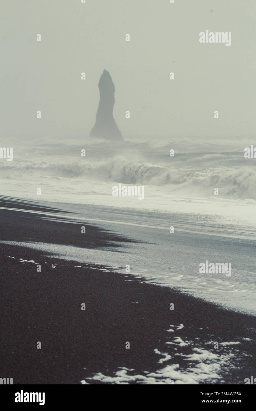 Cliff column in stormy sea landscape photo Stock Photo - Alamy
