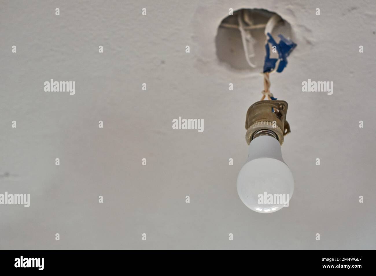 Lightbulb on ceiling hi-res stock photography and images - Alamy