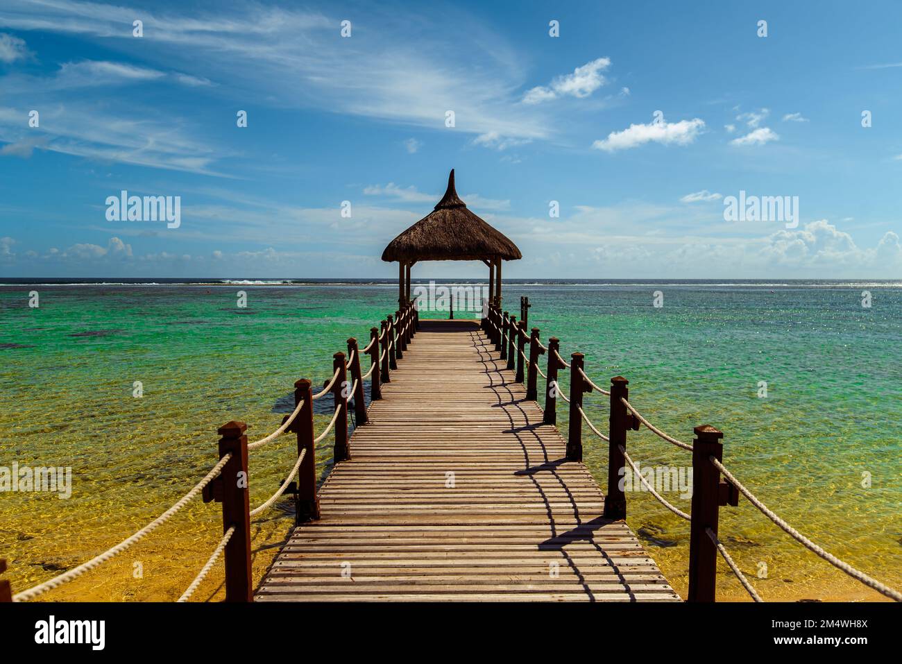 Idillic wood pier in a beach. tropical green area amazing calm mood ...