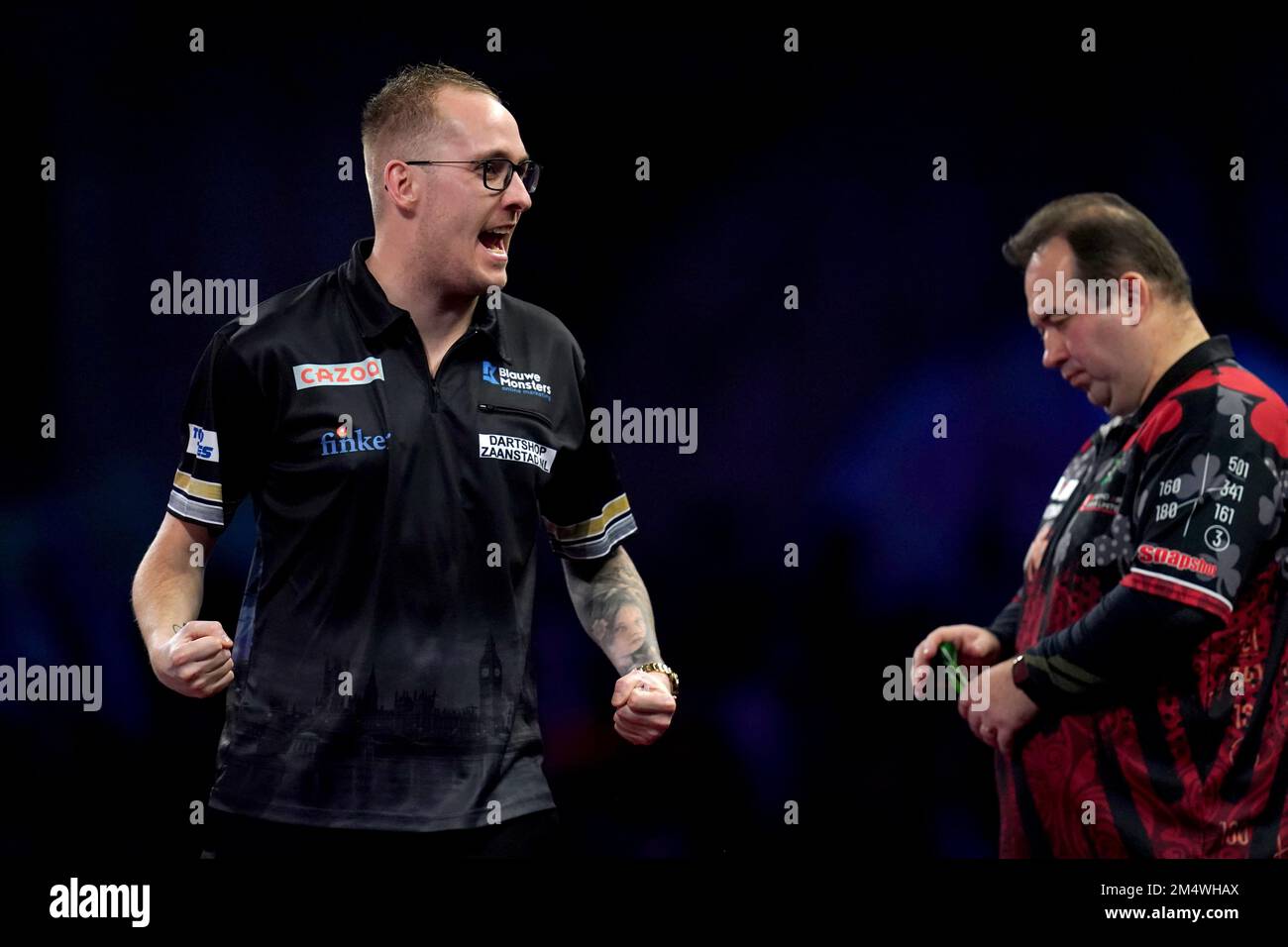 Jimmy Hendriks celebrates during his match against Brendan Dolan (right ...
