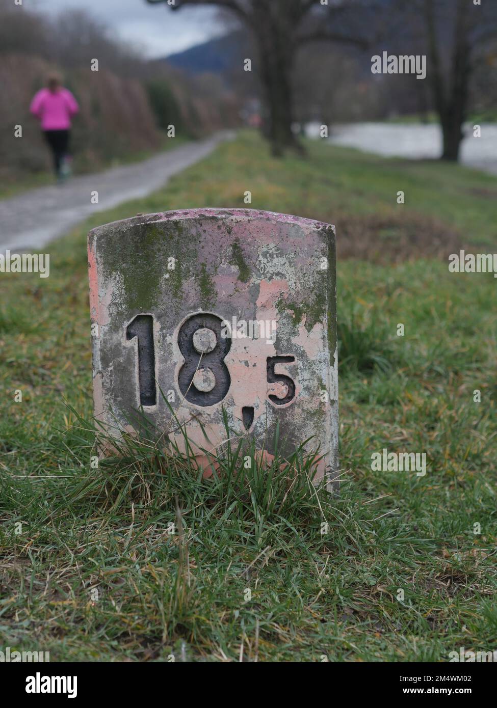 Marking stone pillar in the park with numbers Stock Photo - Alamy