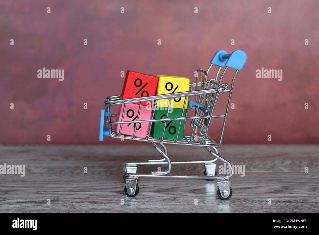 Shopping trolley and colorful blocks with percent sign. Shopping ...
