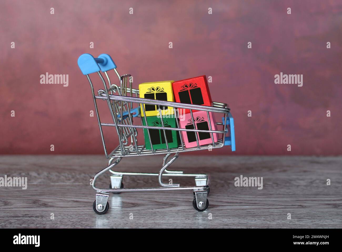 Shopping trolley and colorful blocks with gift box icon. Shopping, buy ...