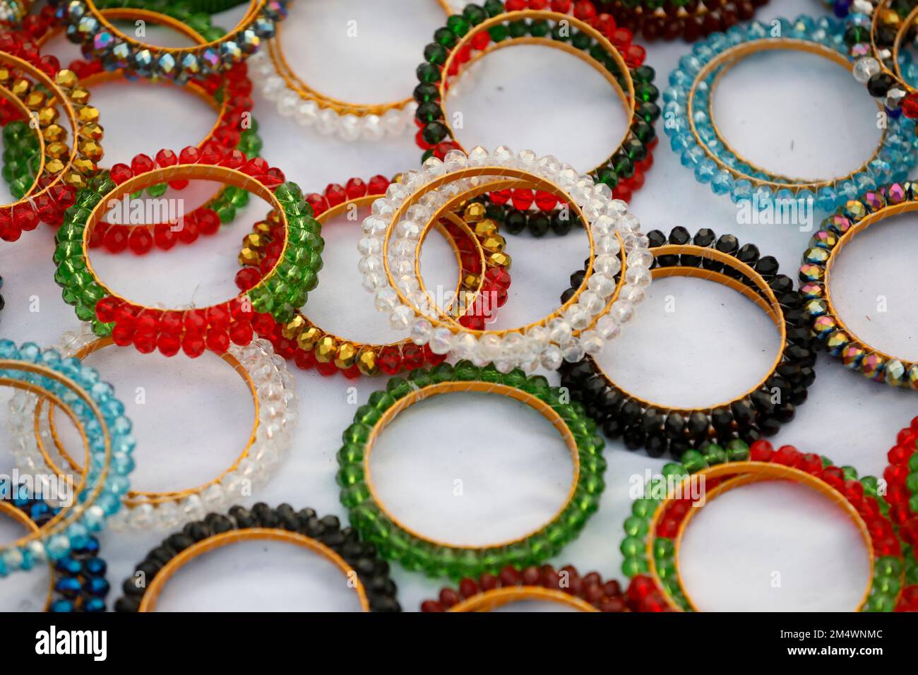 Dhaka, Bangladesh - December 16, 2022: Street hawker display their pearl necklace for sell at ...