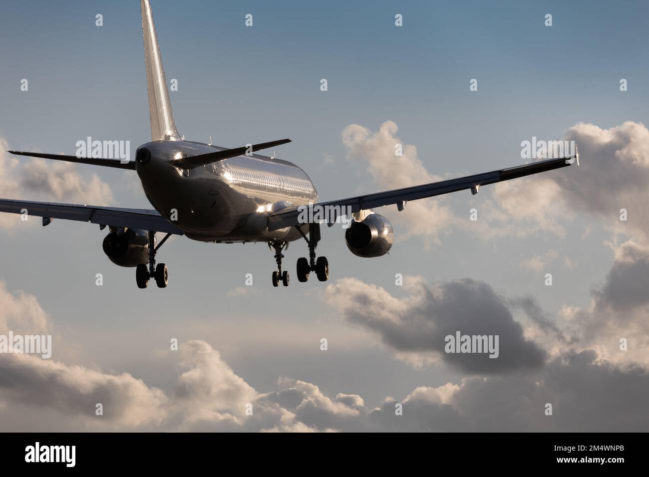 close-up of a silver aircraft in final approach at Stuttgart Airport ...