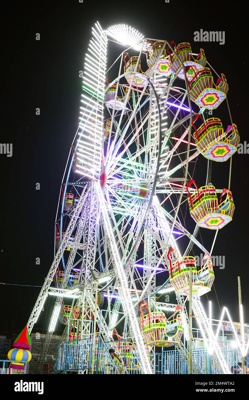 Low angle shot of Giant ferris wheel with Beautiful lighting in An ...