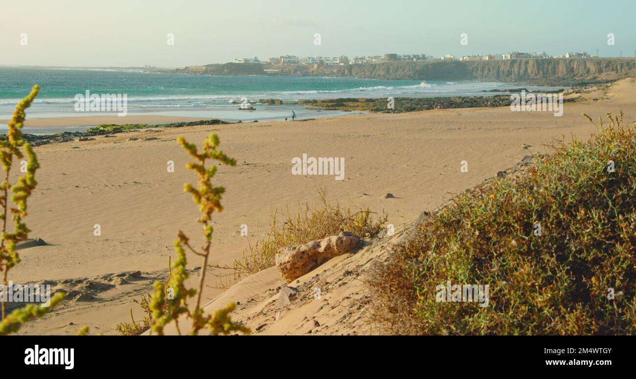 White famous fine sand beach Playa del Castillo. Ocean crystal waves ...