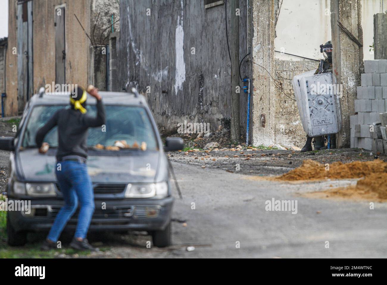 Nablus, Palestine. 23rd Dec, 2022. An Israeli soldier takes cover ...