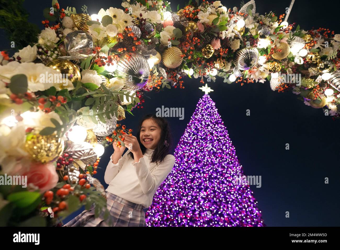 Models poses for pictures with Christmas installations and a Tallest Outdoor Christmas Tree ...