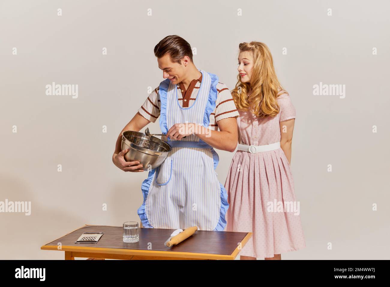 Breaking gender stereotypes. Friendly family couple in retro style ...