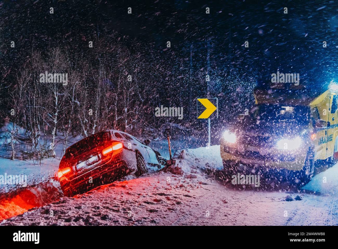 The roadside assistance service pulling the car out of the canal. An ...