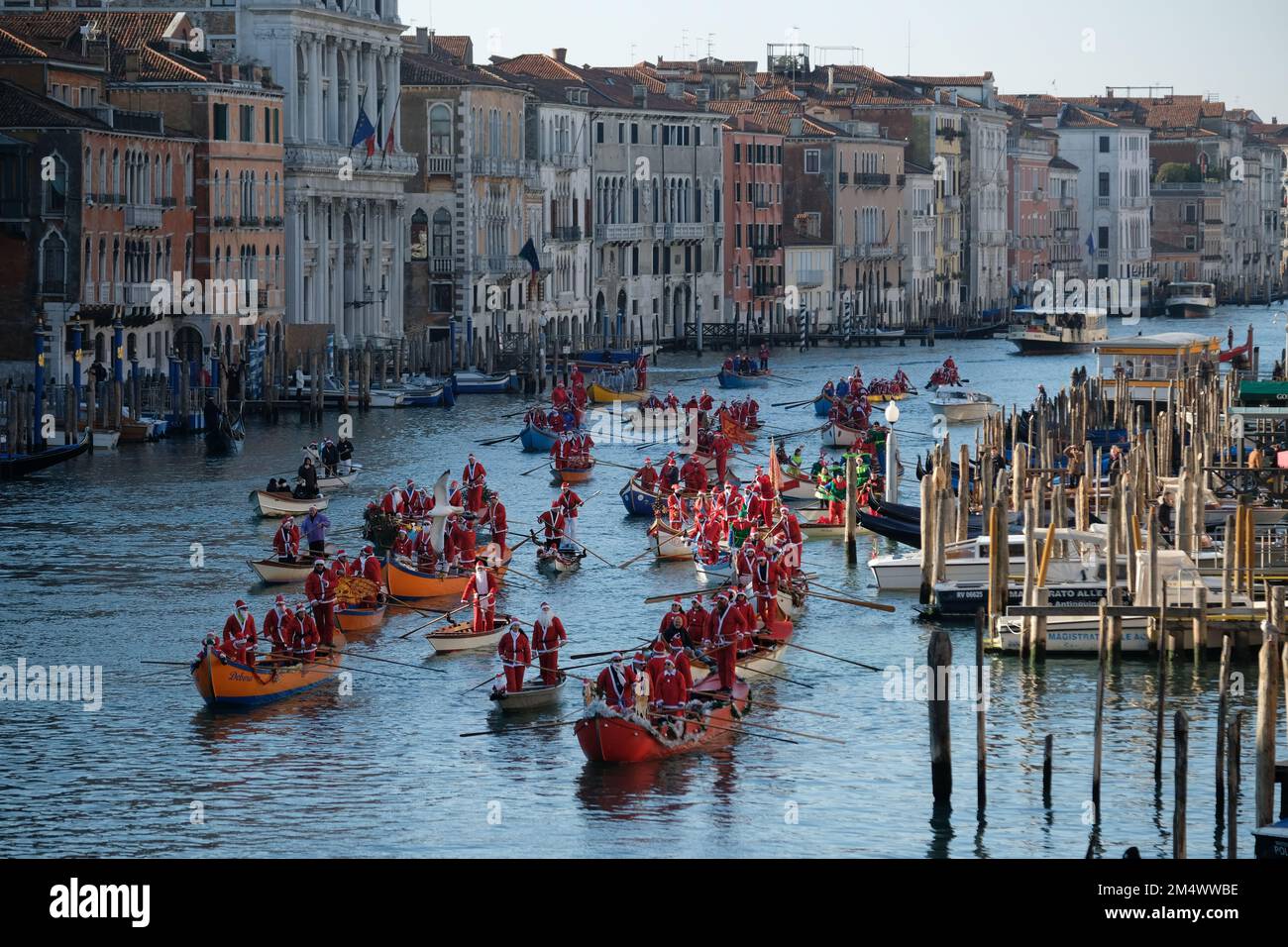 People dressed as Santa Claus row during a Christmas regatta along the ...
