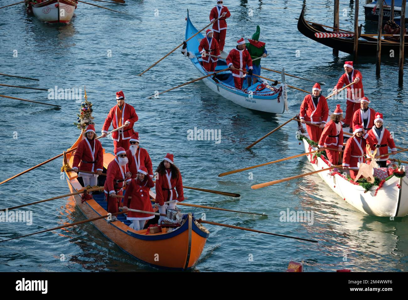 People dressed as Santa Claus row during a Christmas regatta along the ...