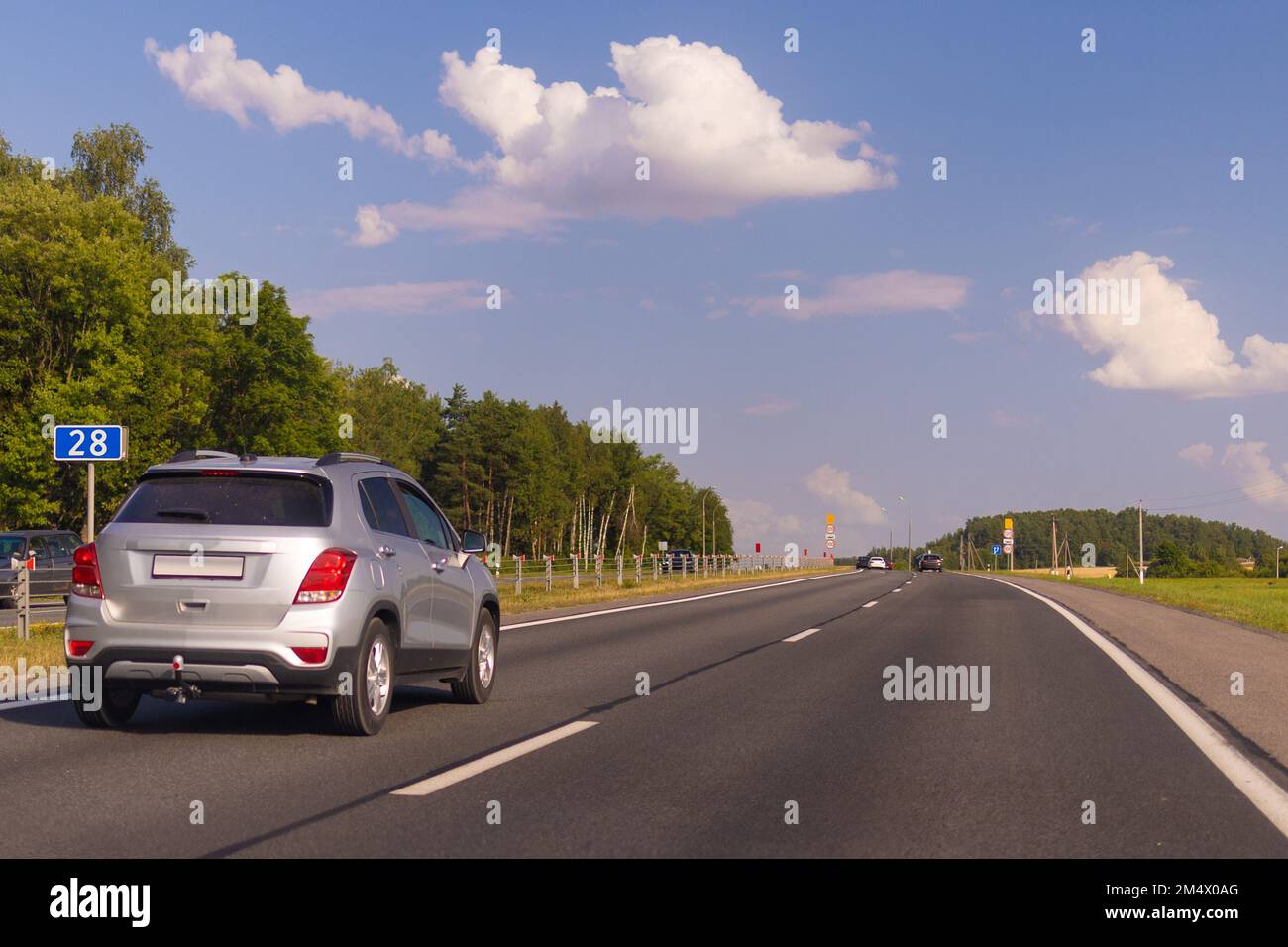 Highway wide road, transport and blue sky with clouds on a summer day ...