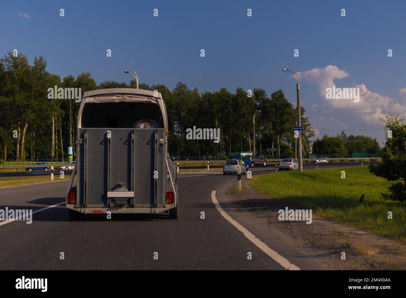 Highway wide road, transport and blue sky with clouds on a summer day ...