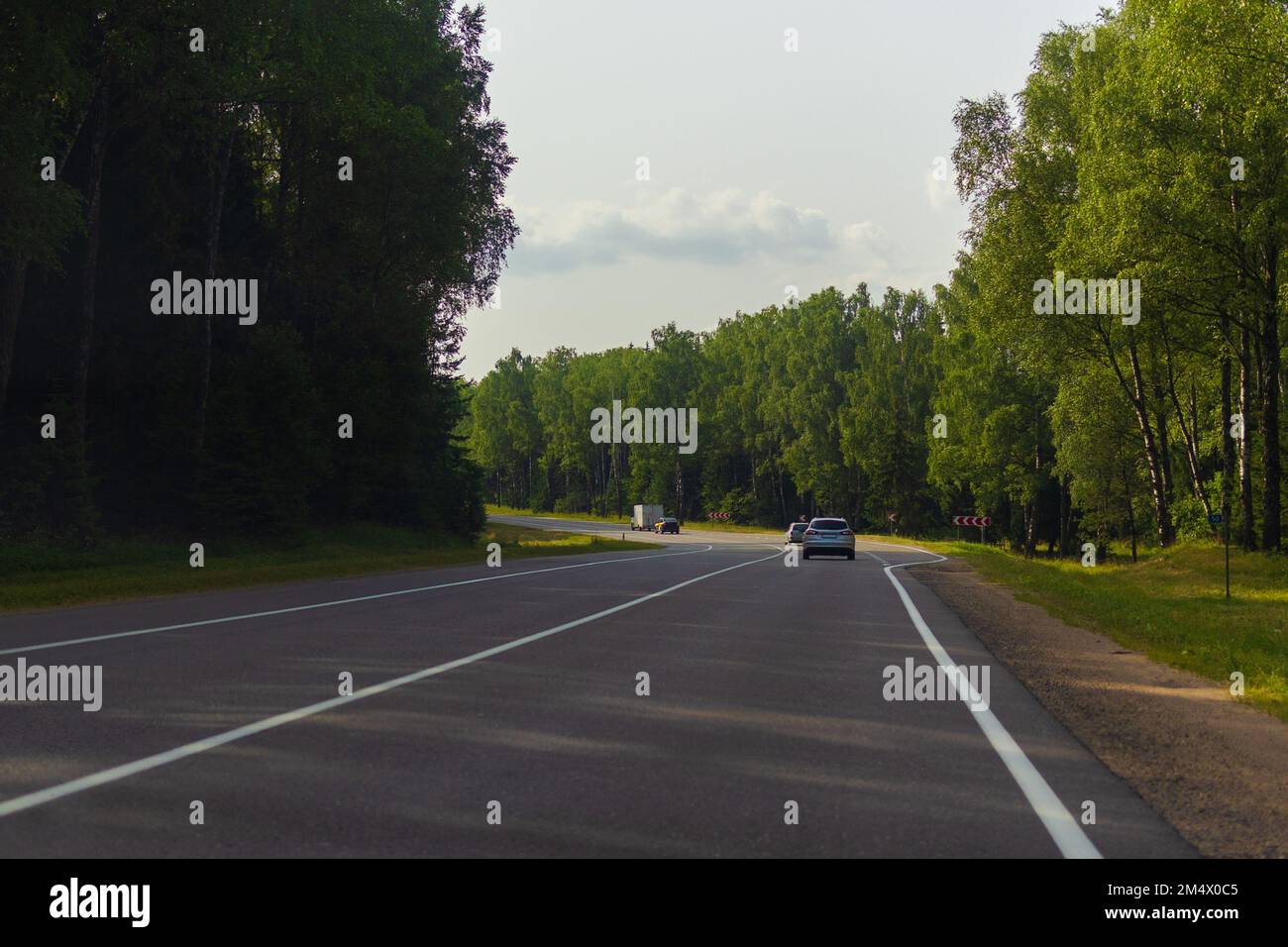 Highway wide road, transport and blue sky with clouds on a summer day ...