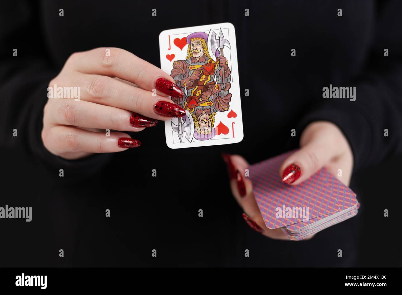 Female hands hold a deck of cards and show tricks Stock Photo - Alamy