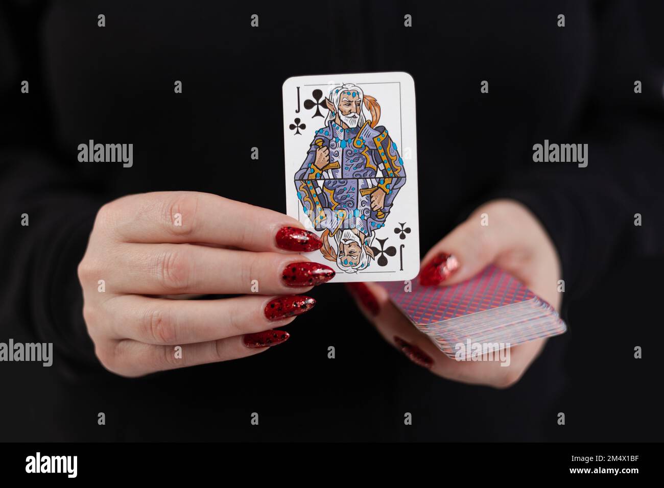 Hands holding fan of cards hi-res stock photography and images - Alamy
