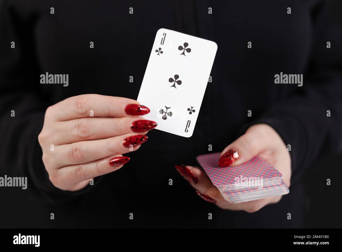Female hands hold a deck of cards and show tricks Stock Photo - Alamy