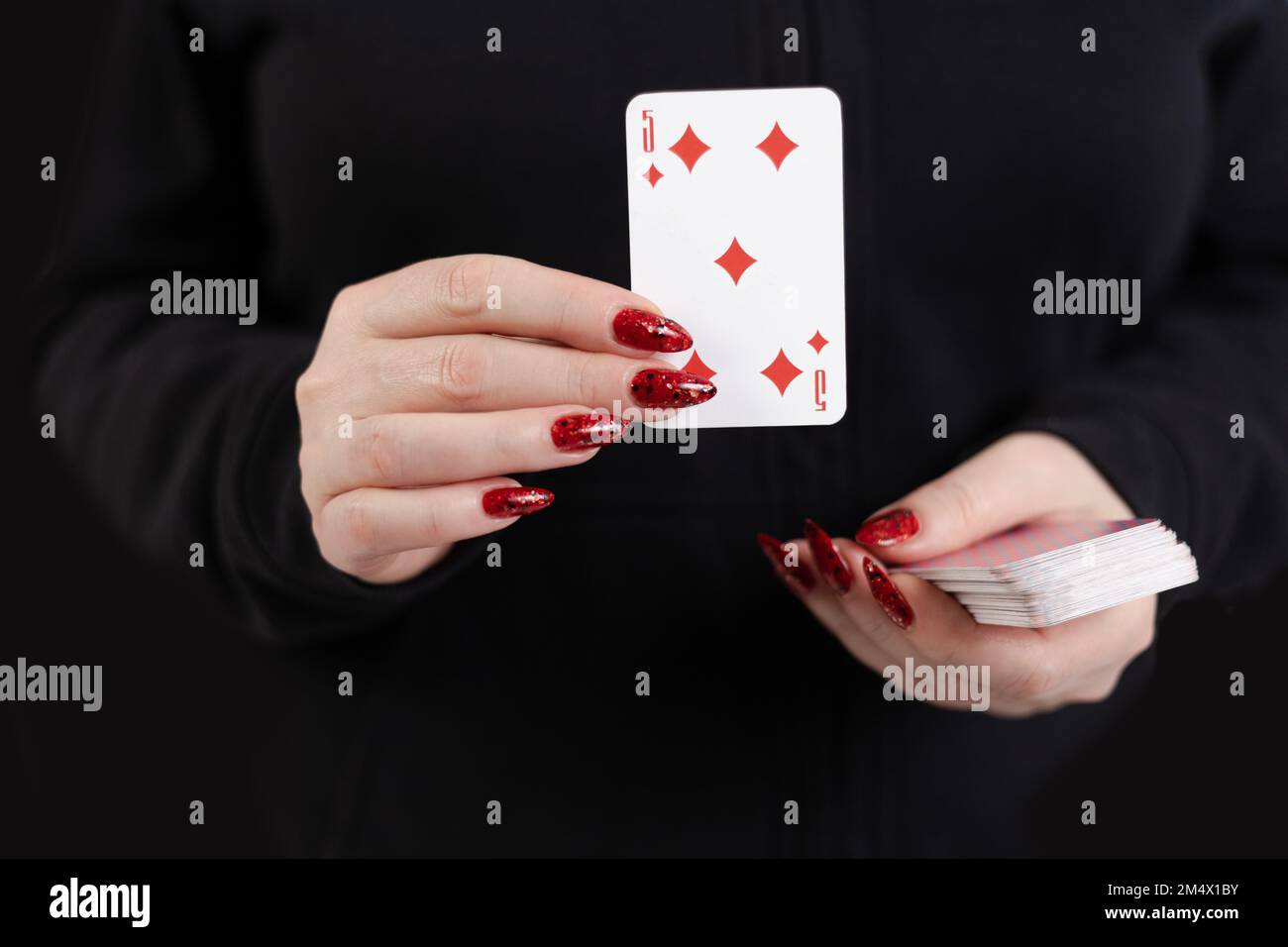 Female hands hold a deck of cards and show tricks Stock Photo - Alamy