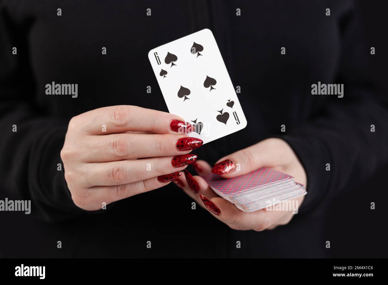 Hands holding fan of cards hi-res stock photography and images - Alamy