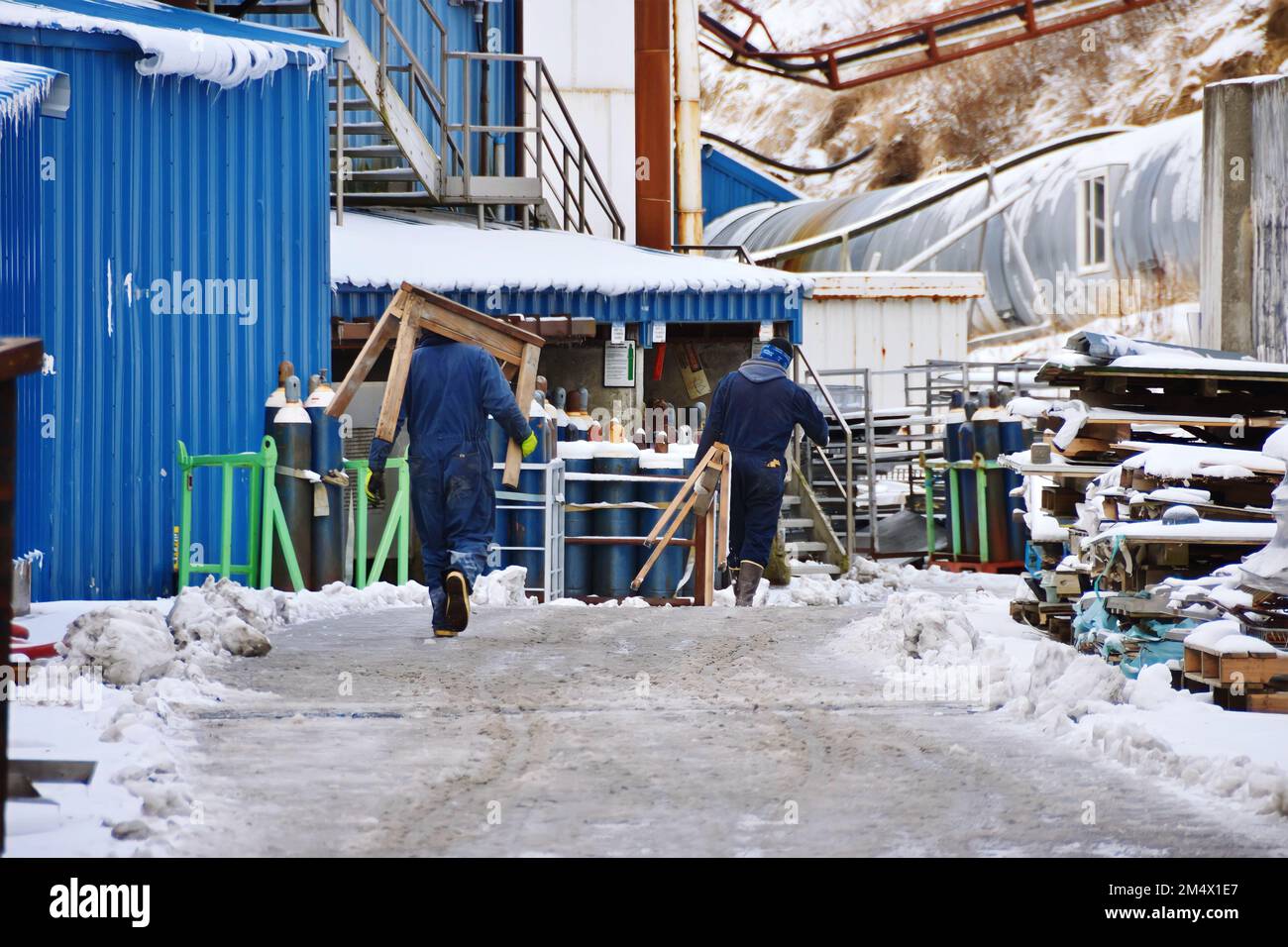 A couple of construction workers working during the day in winter Stock ...