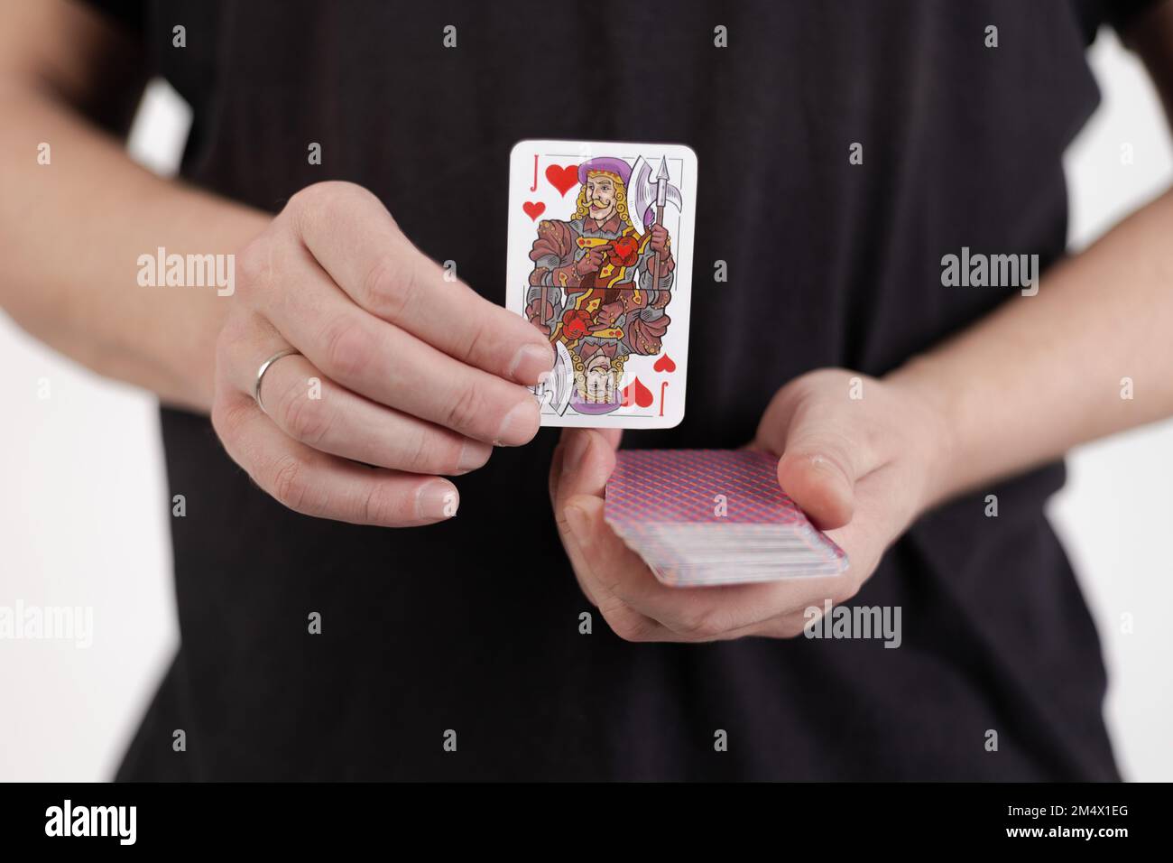 Male hands hold a deck of cards and show tricks Stock Photo - Alamy