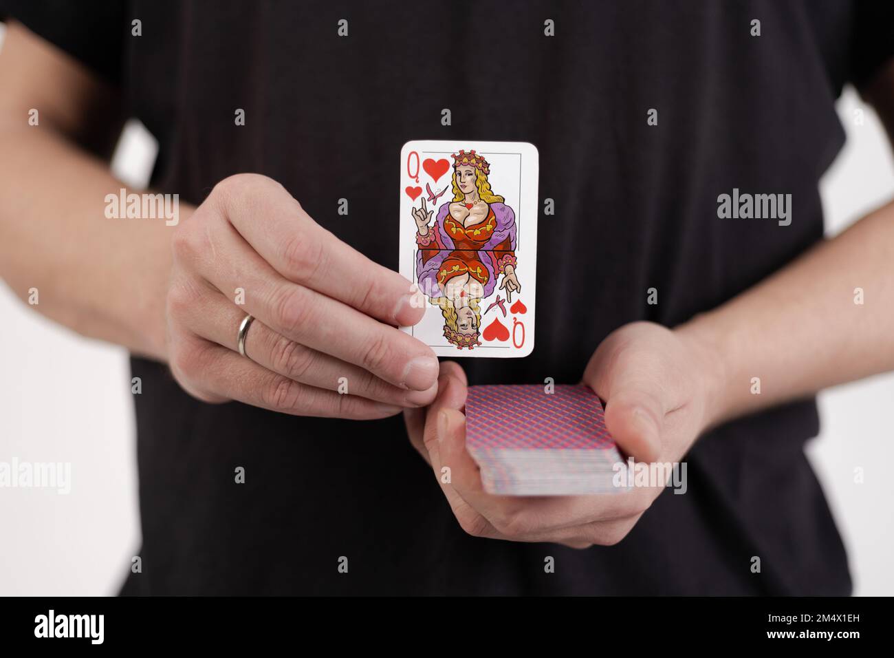 Male hands hold a deck of cards and show tricks Stock Photo - Alamy