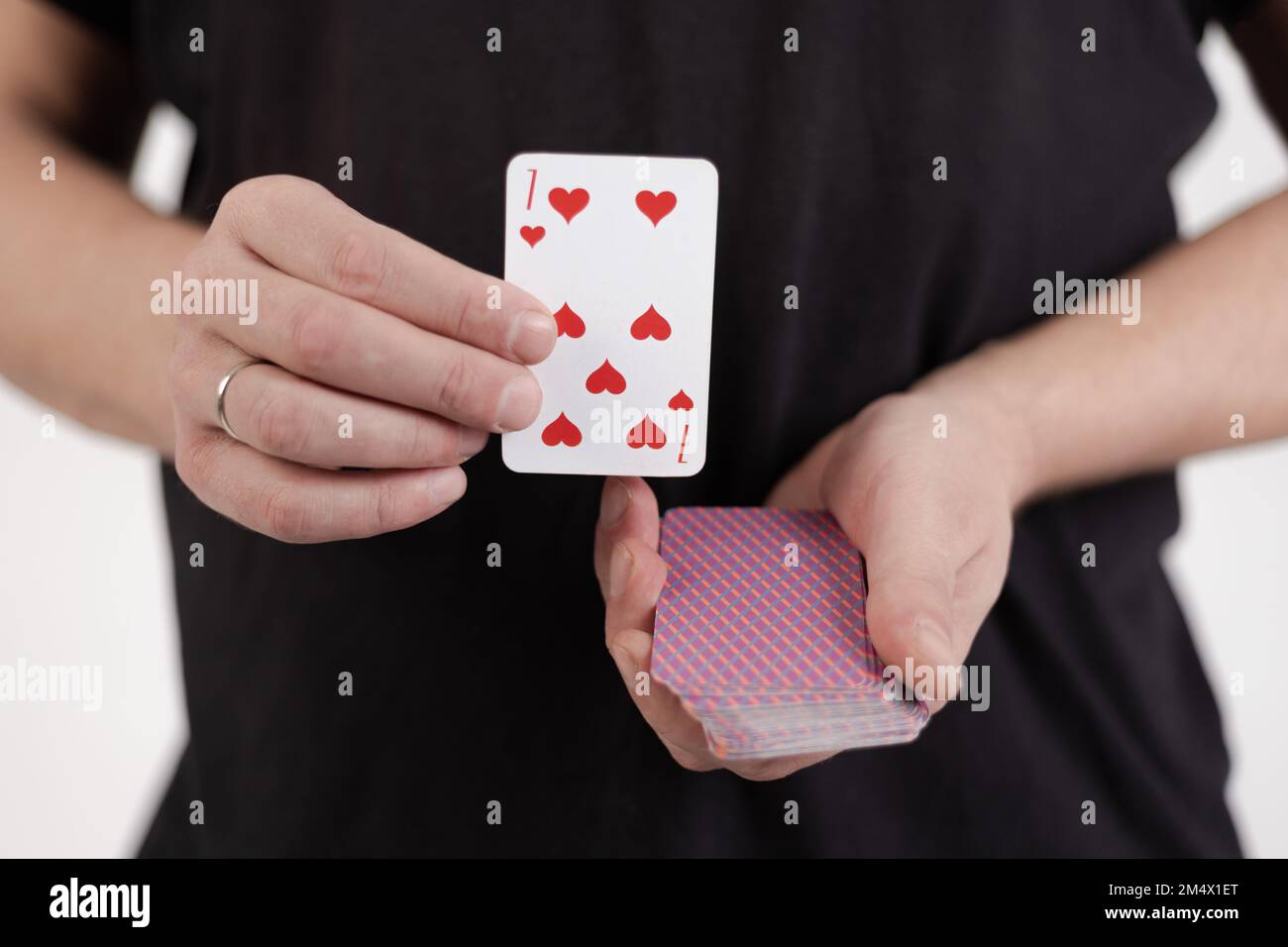 Male hands hold a deck of cards and show tricks Stock Photo - Alamy