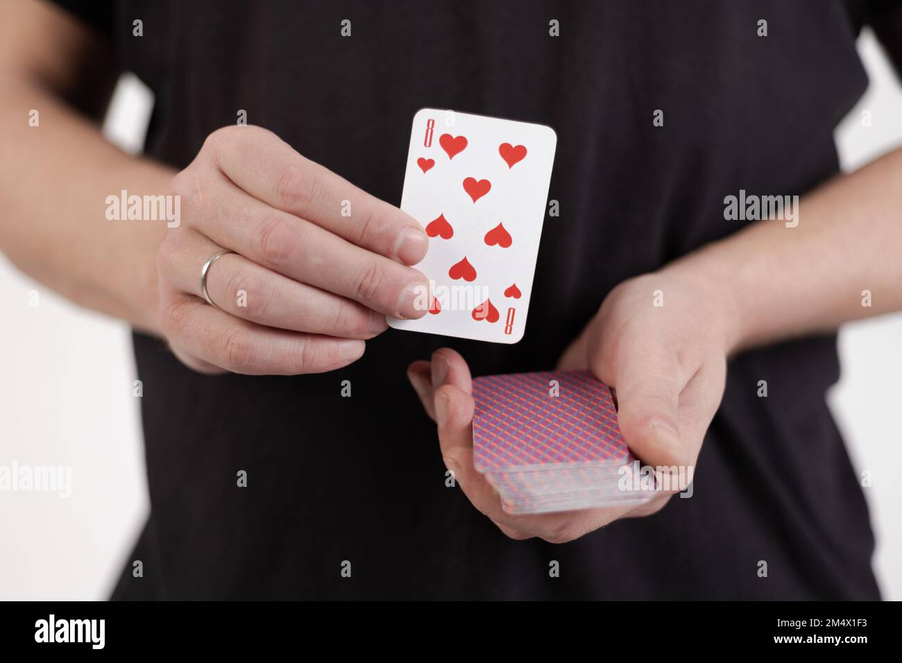Male hands hold a deck of cards and show tricks Stock Photo - Alamy