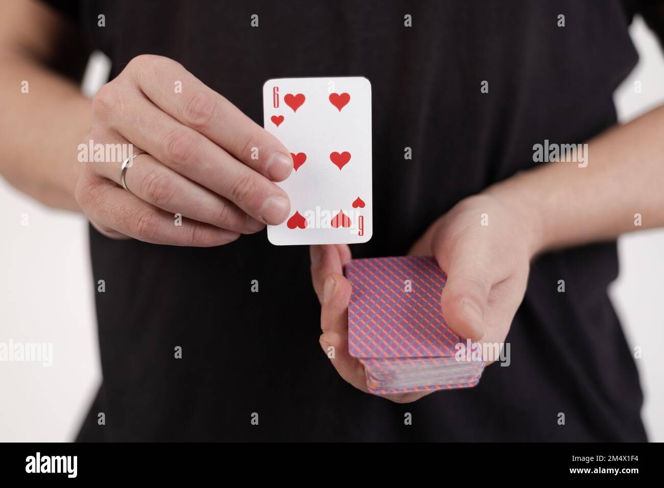 Male hands hold a deck of cards and show tricks Stock Photo - Alamy