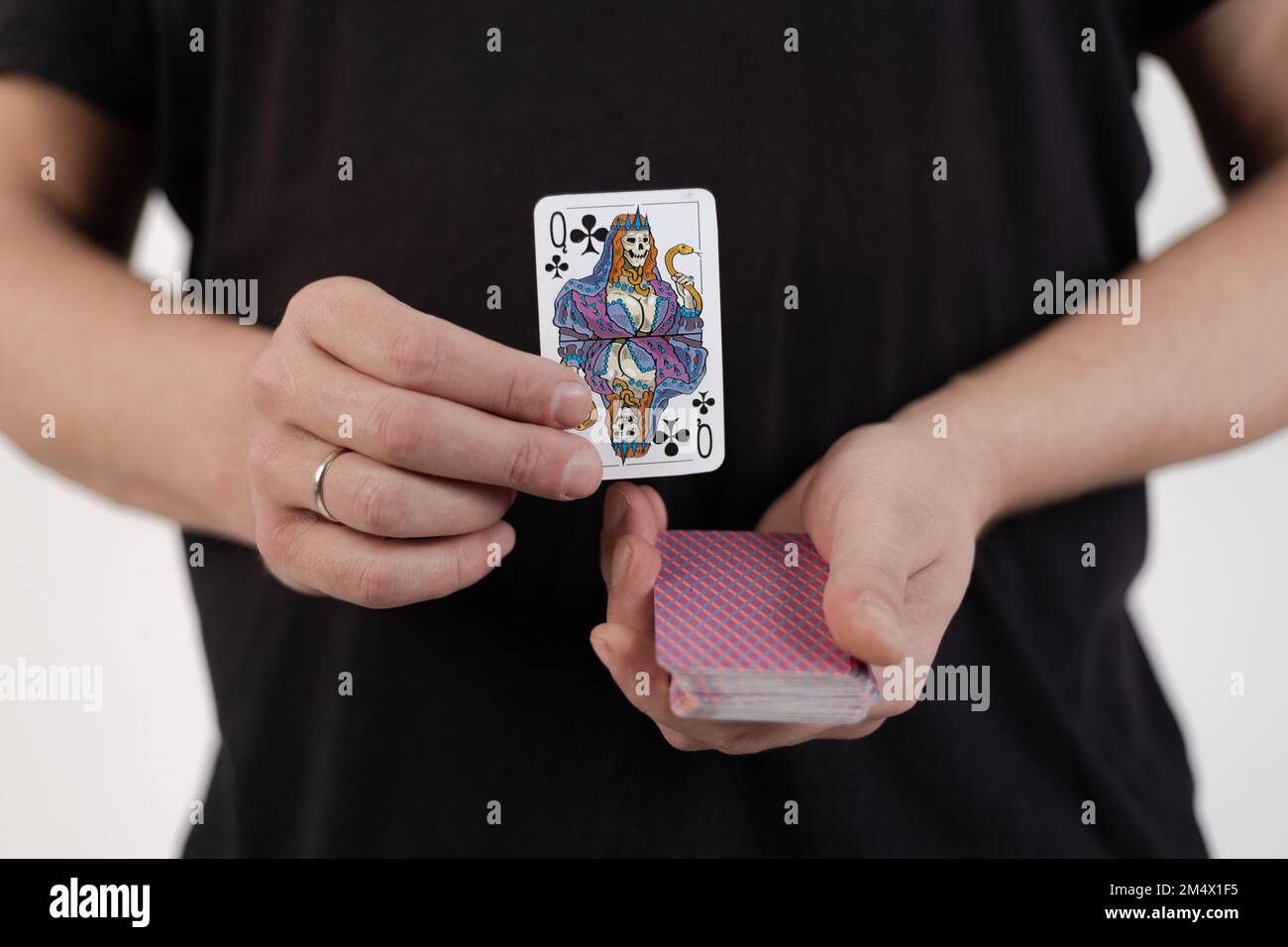 Male hands hold a deck of cards and show tricks Stock Photo - Alamy