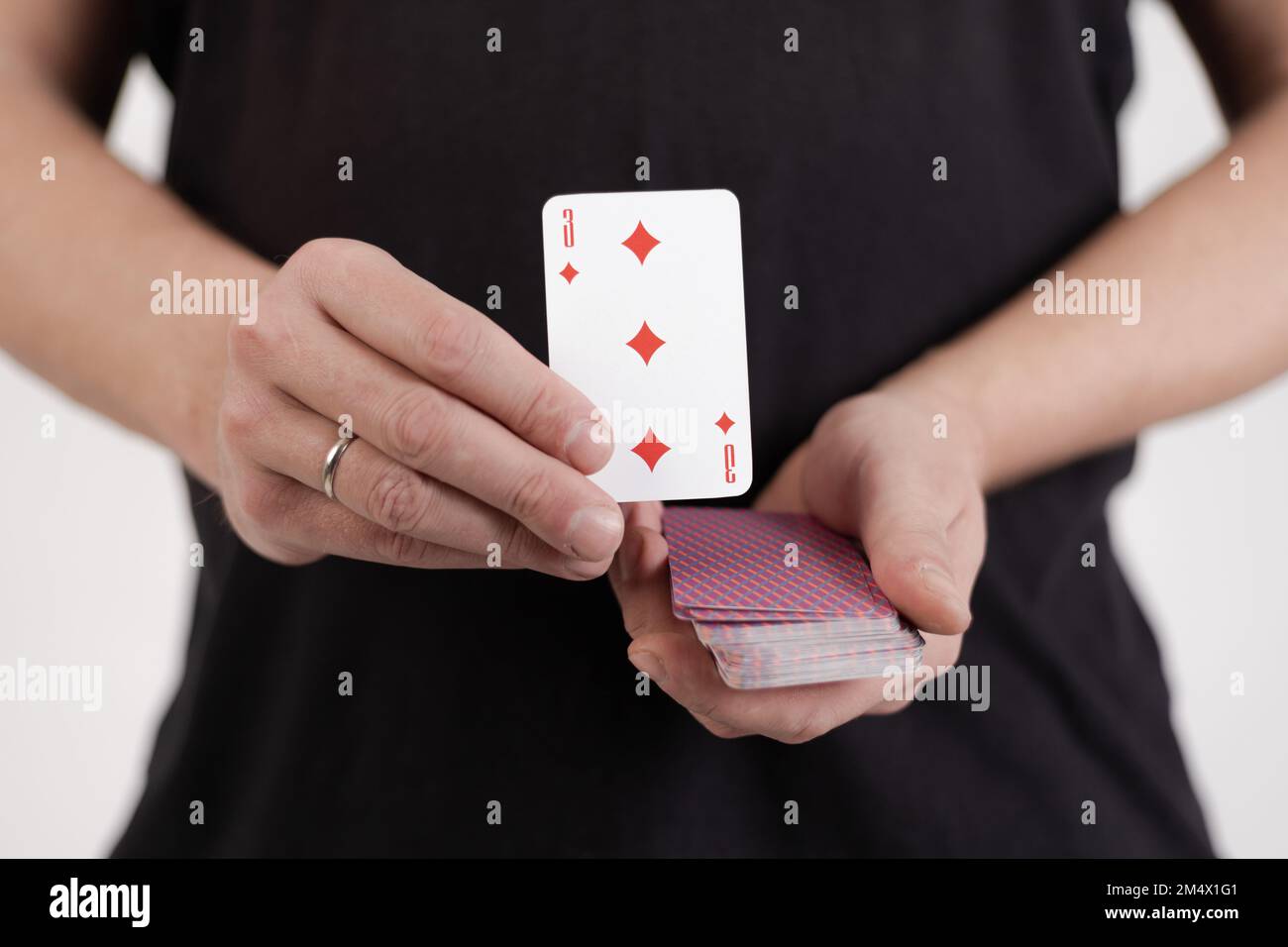 Male hands hold a deck of cards and show tricks Stock Photo - Alamy