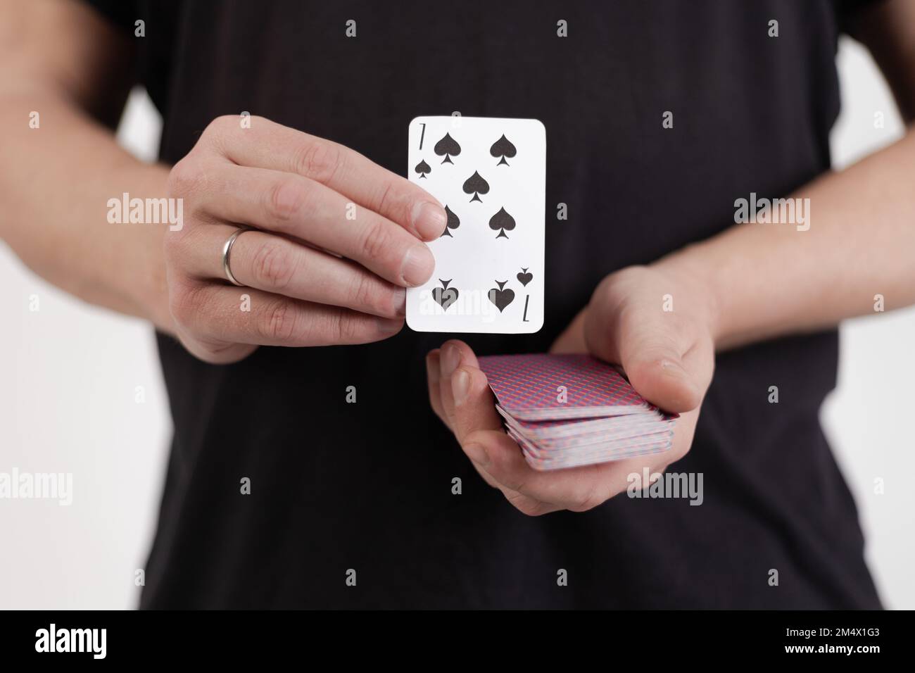 Male hands hold a deck of cards and show tricks Stock Photo - Alamy