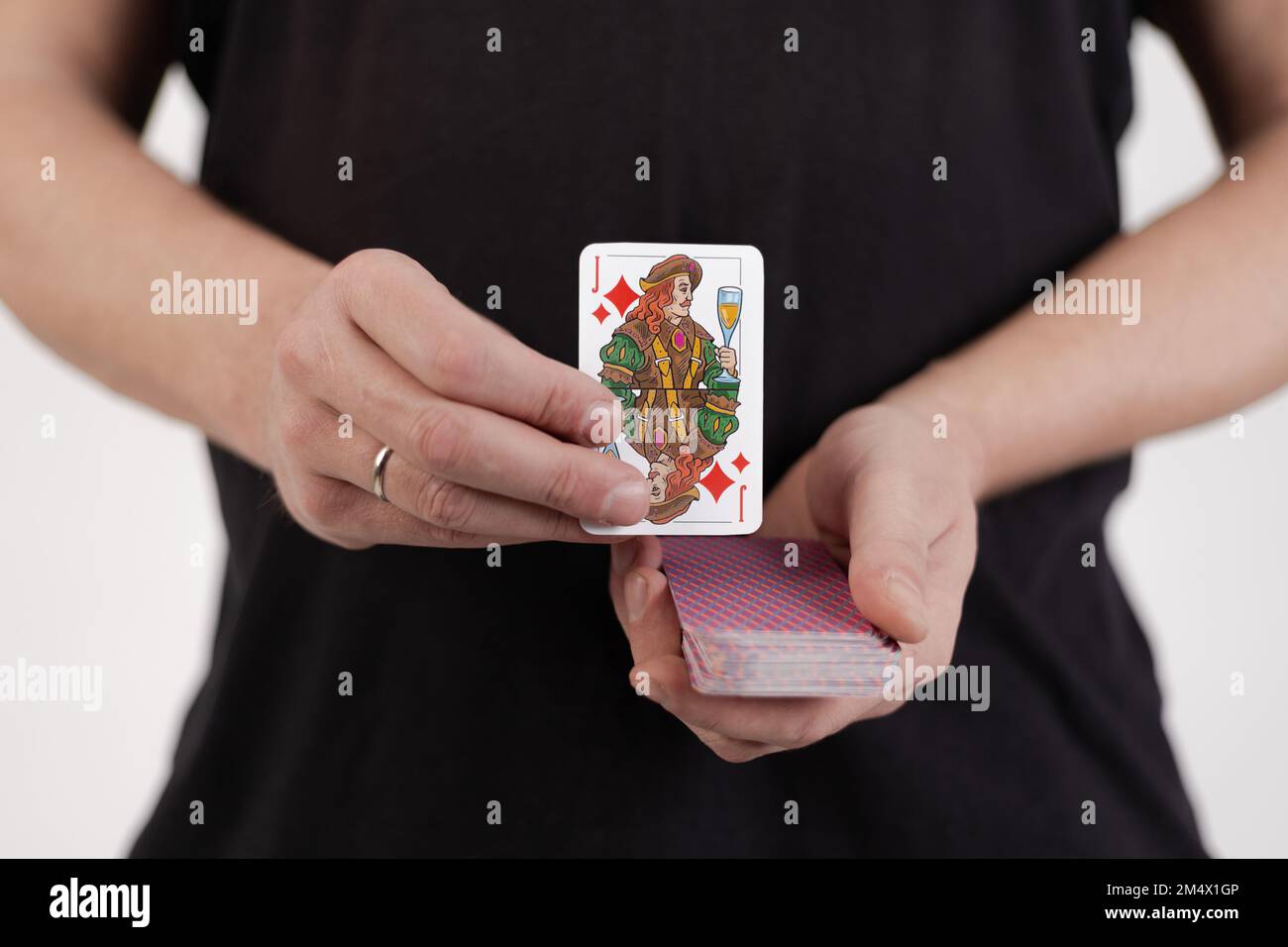 Male hands hold a deck of cards and show tricks Stock Photo - Alamy