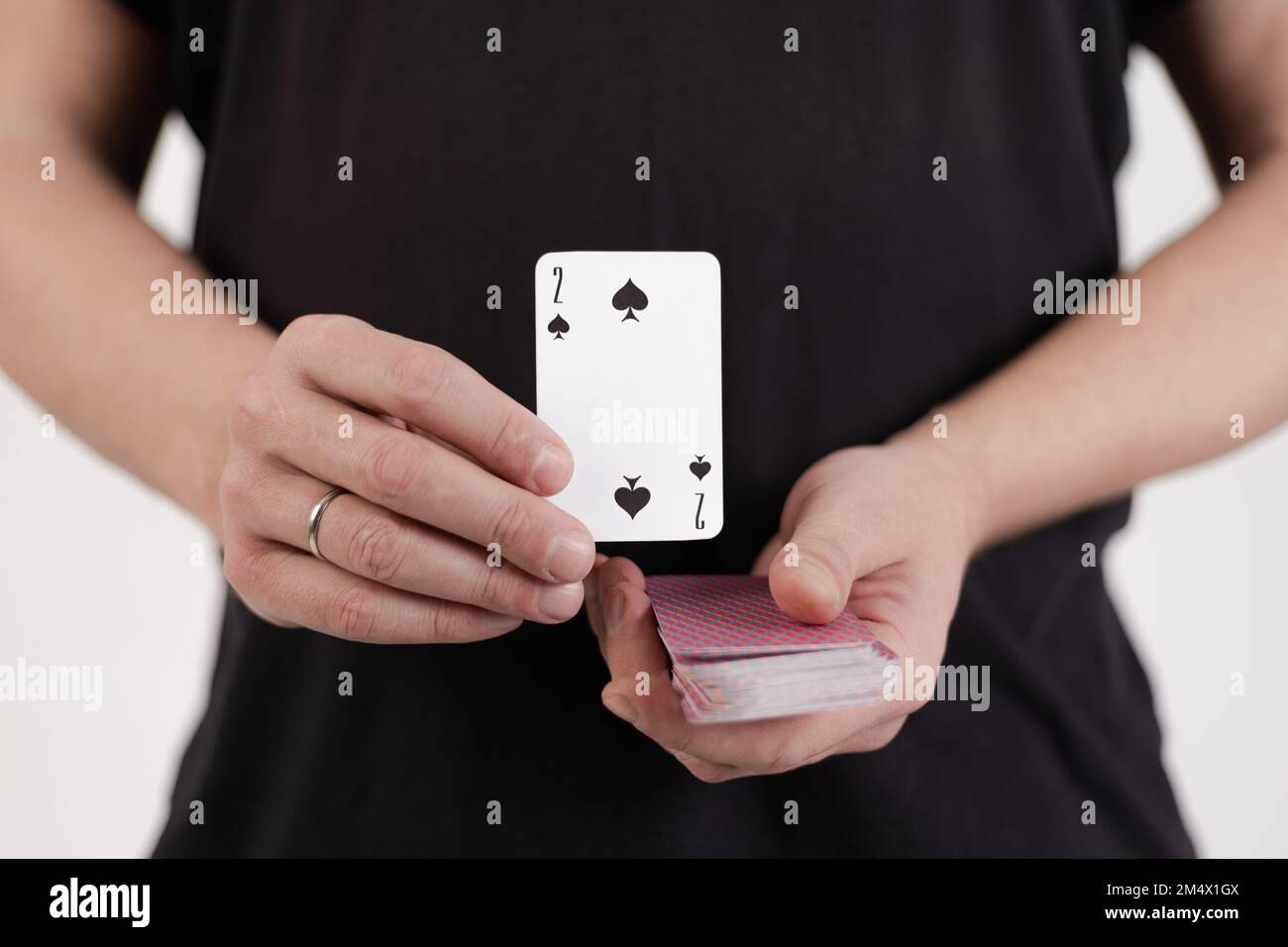 Male hands hold a deck of cards and show tricks Stock Photo - Alamy