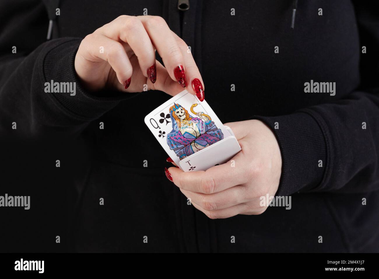 Female hands hold a deck of cards and show tricks Stock Photo - Alamy