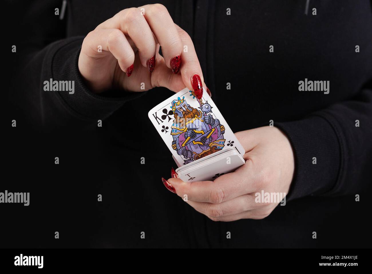 Female hands hold a deck of cards and show tricks Stock Photo - Alamy