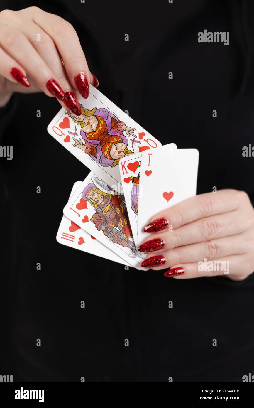 Female hands hold a deck of cards and show tricks Stock Photo - Alamy