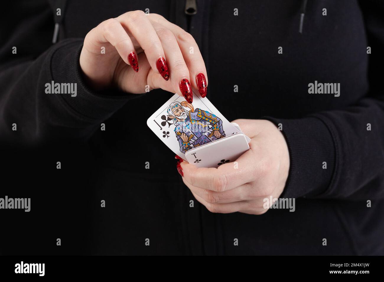 Female hands hold a deck of cards and show tricks Stock Photo - Alamy