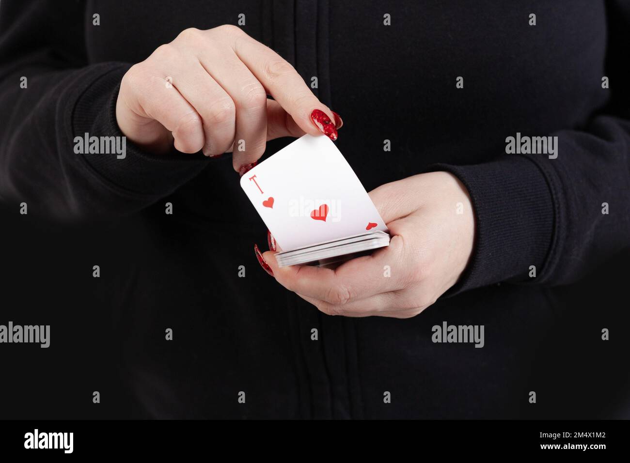 Woman playing solitaire card game hi-res stock photography and images ...